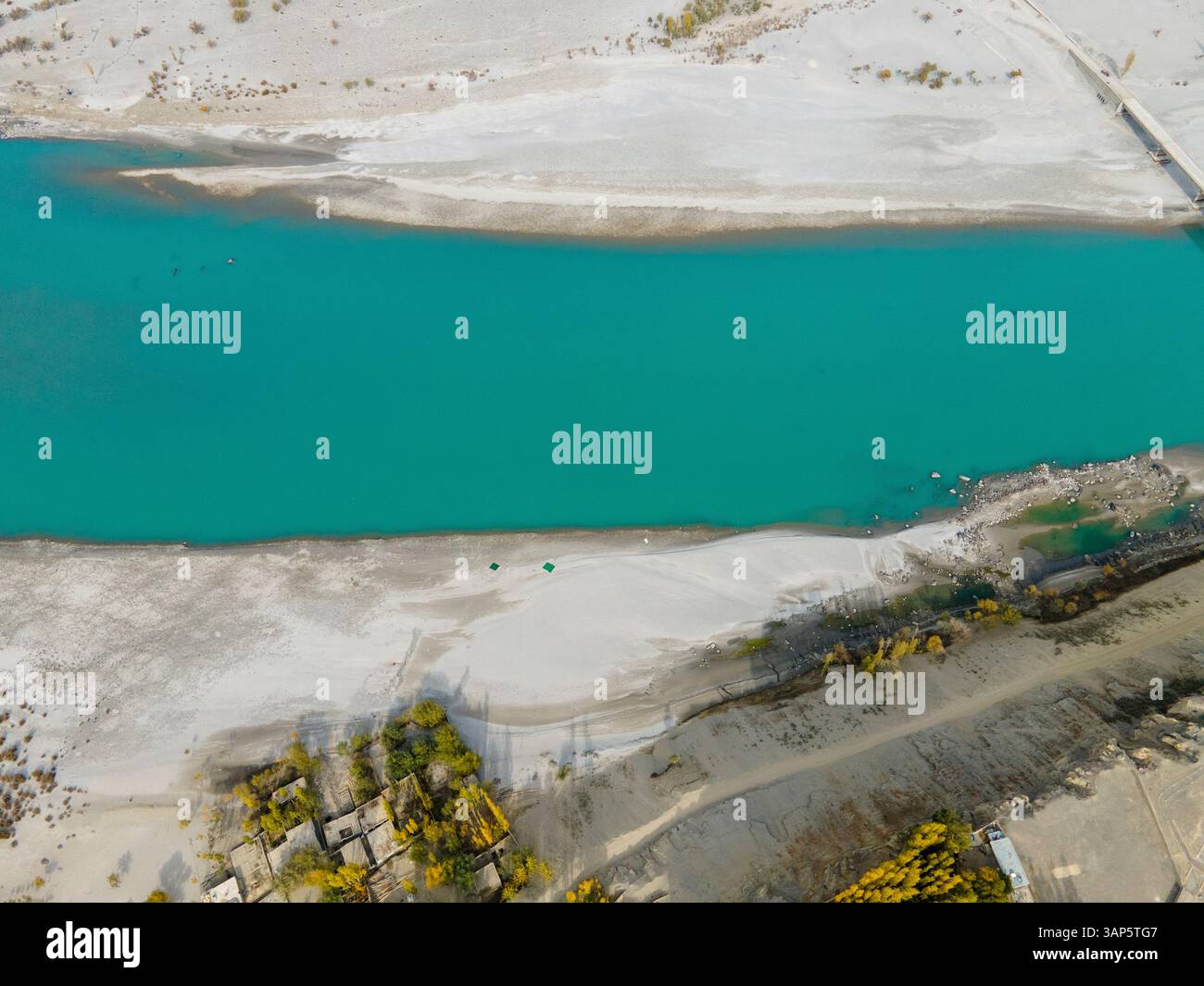 Aerial view of Indus River with turquoise water and sandy shore, Skardu ...