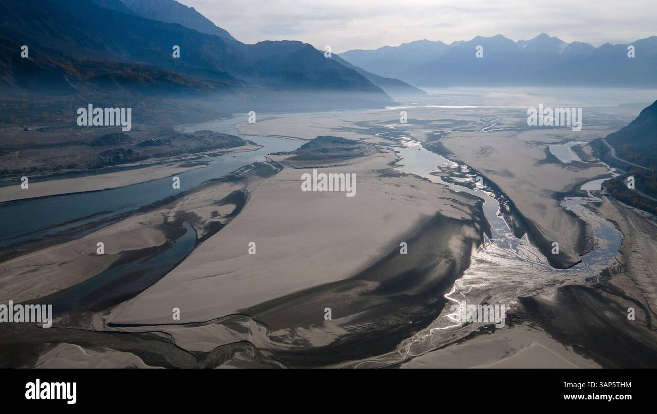 Aerial view of Indus River winding through majestic mountains and ...