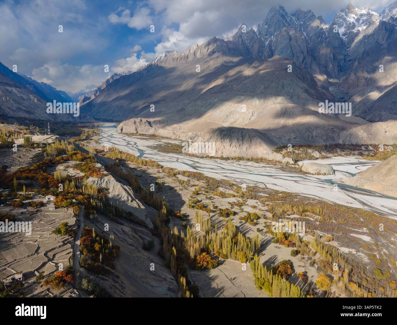 Aerial view of majestic mountains, pristine valley, and winding river ...