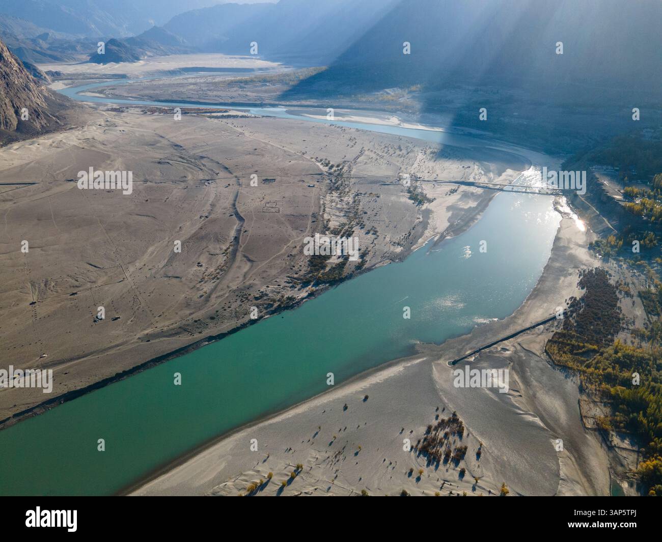 Aerial view of Indus River winding through majestic mountains in Skardu ...