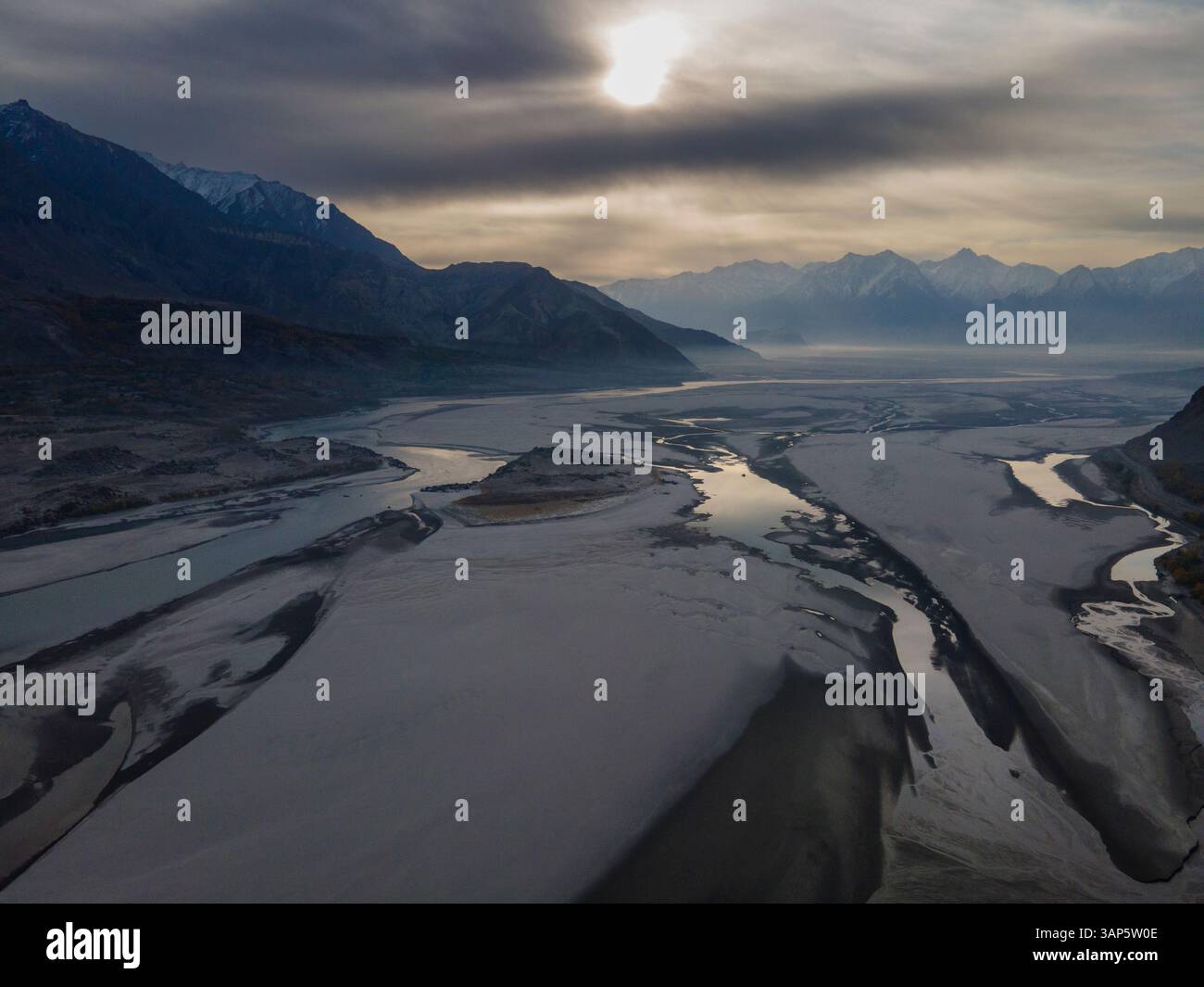 Aerial view of snow-covered mountains and river at Kachura Lakes ...