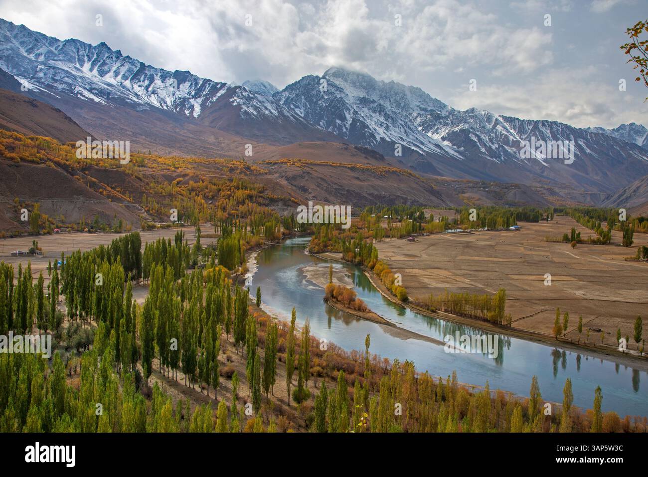 Aerial view of majestic Phander Valley with river, mountains, and trees ...
