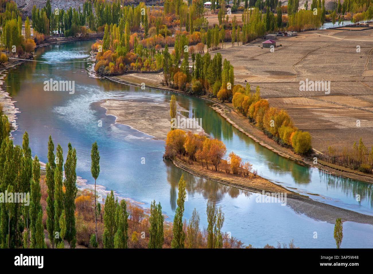 Aerial view of meandering river with colorful autumn trees, Phander ...