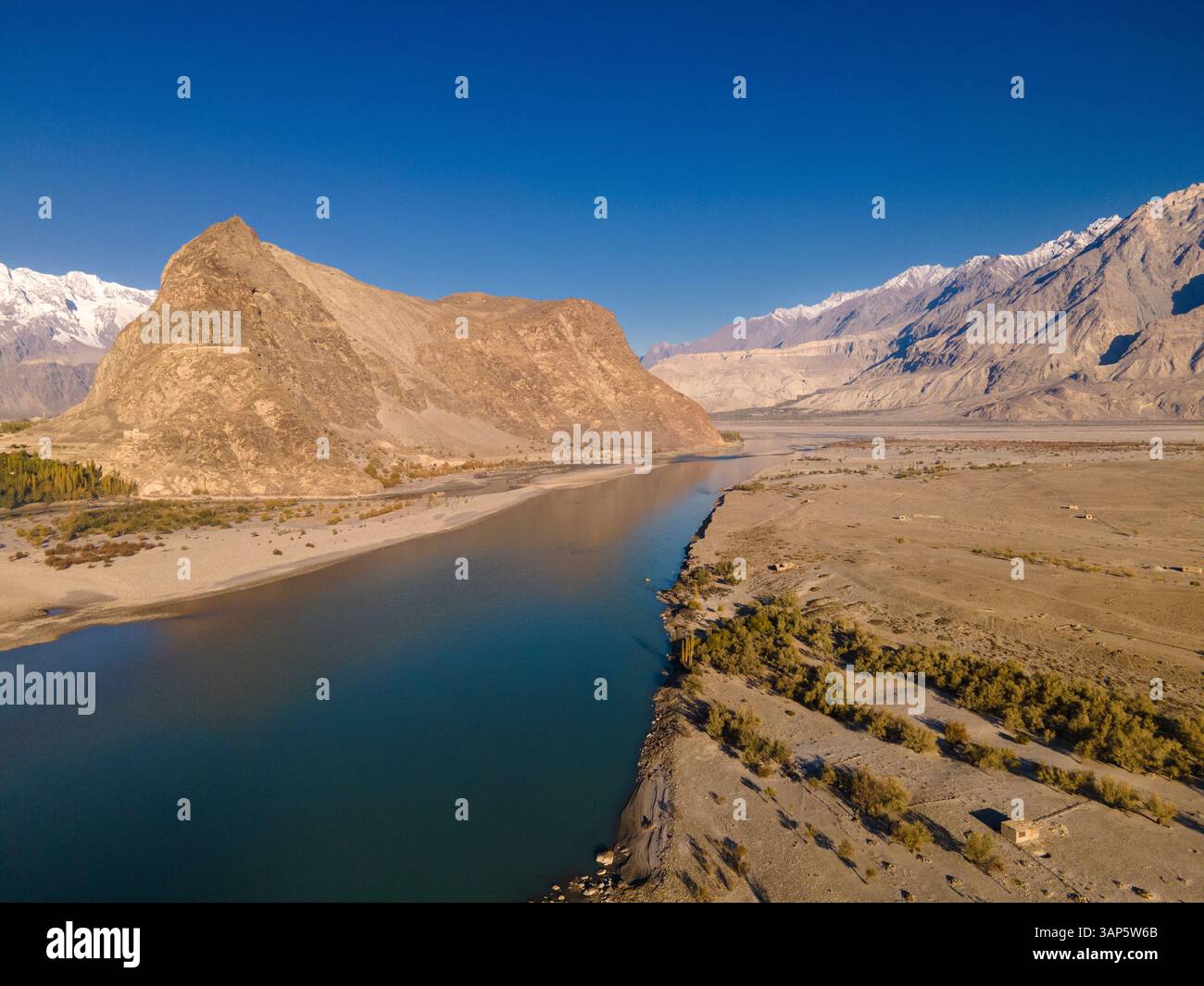 Aerial view of Indus River flowing through majestic Himalayan mountains ...