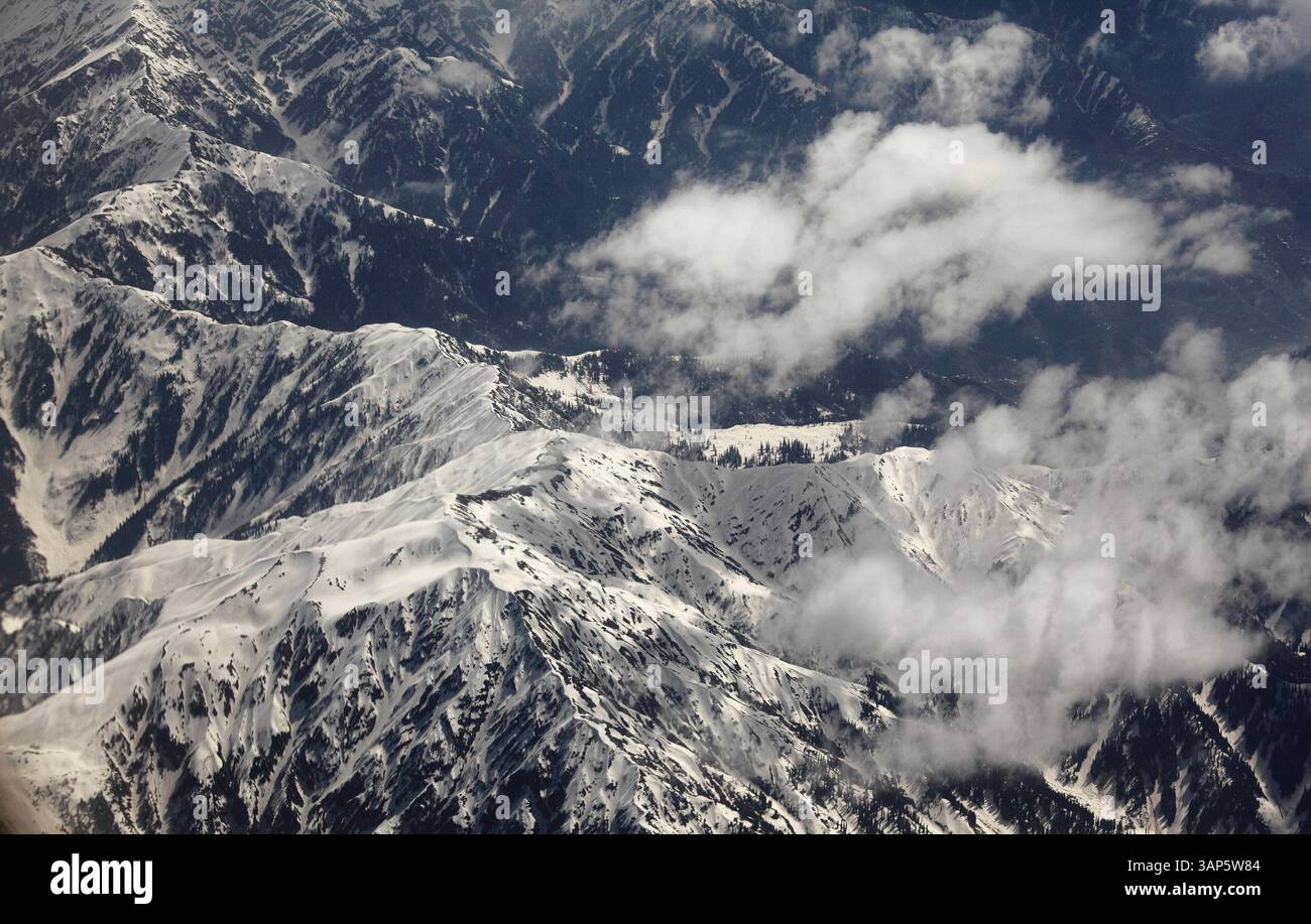 Aerial view of snow-capped mountains in Karakoram mountain range ...