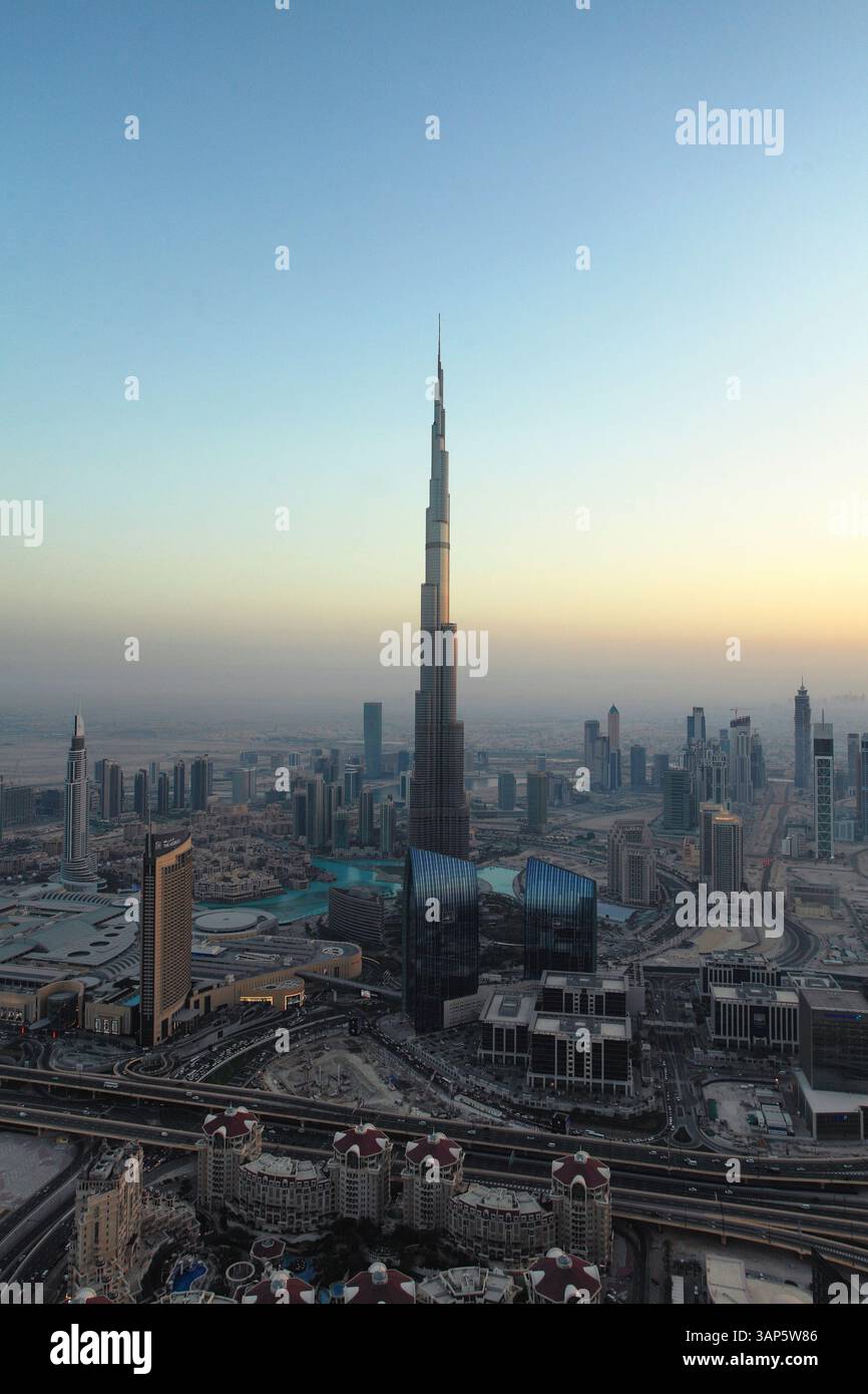 Aerial view of modern Dubai skyline with Burj Khalifa at night, United ...