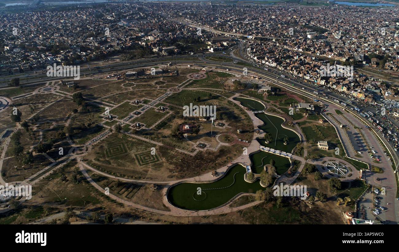 Aerial view of historic city park with dense housing and urban greenery ...