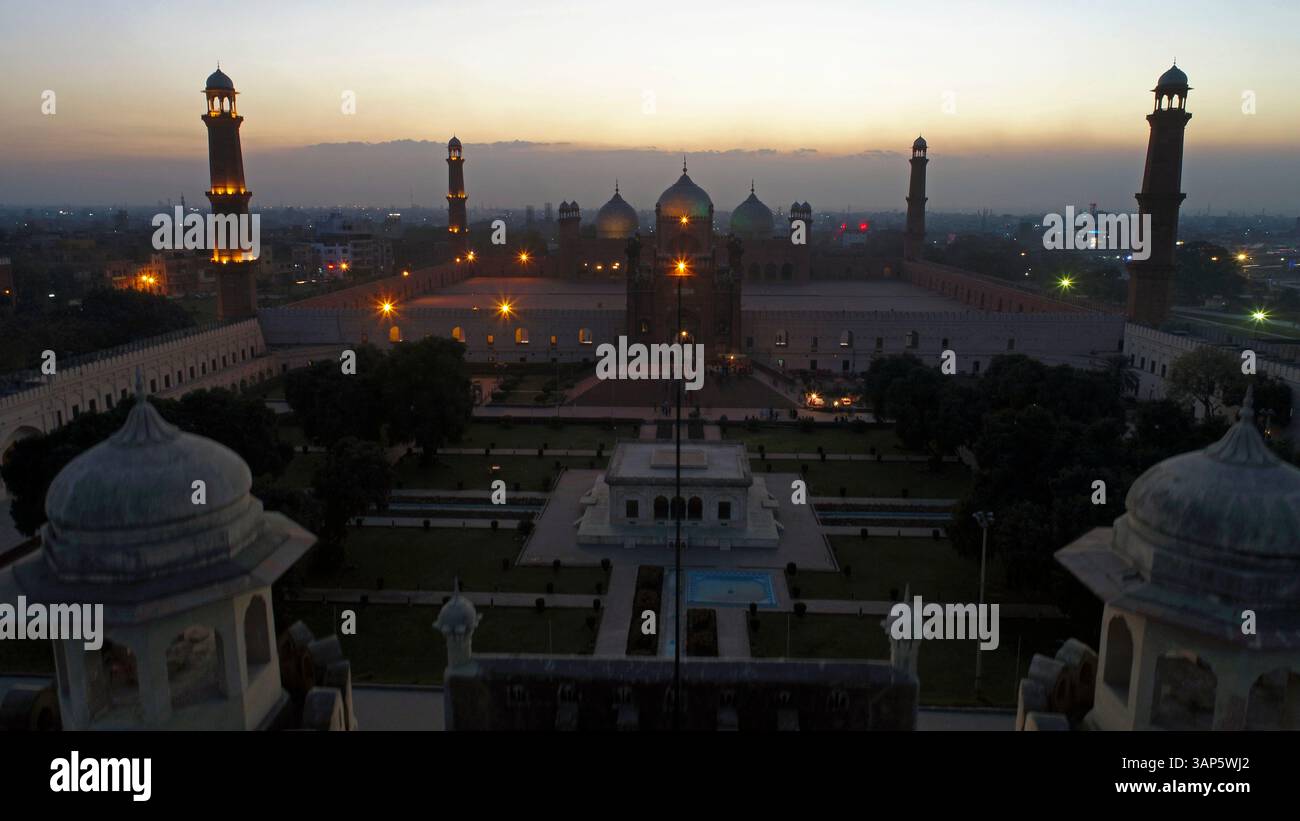 Aerial view of historic mosque with minarets and domes in courtyard ...