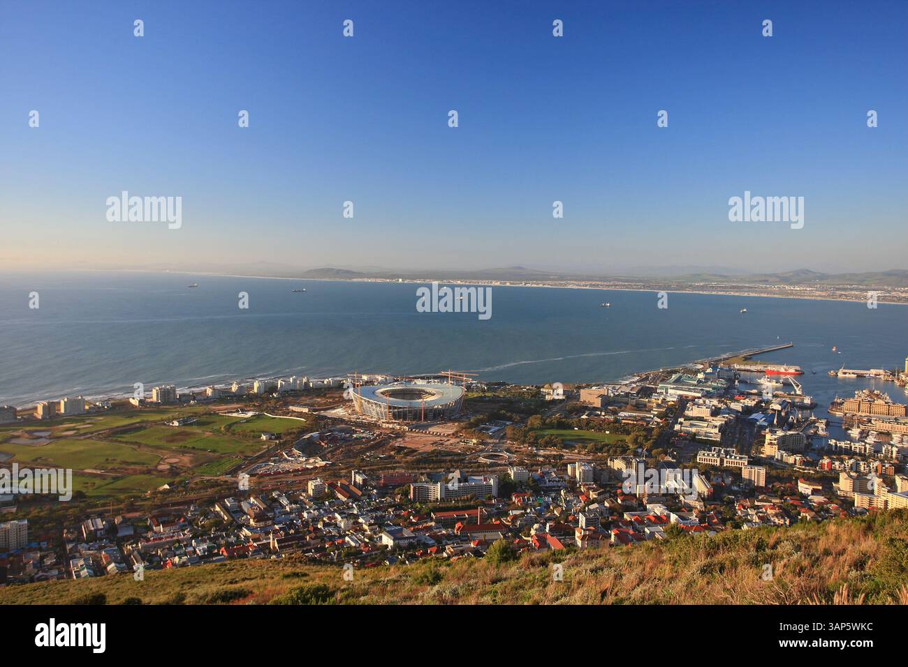 Aerial view of Cape Town Stadium and cityscape by the coast, Cape Town ...