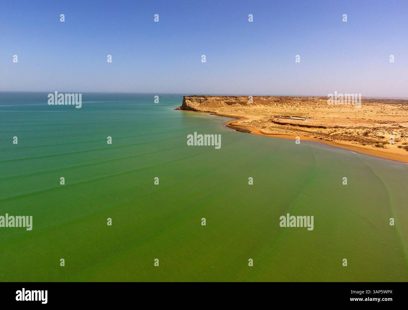 Aerial view of remote unspoiled beach with turquoise water and rocky ...