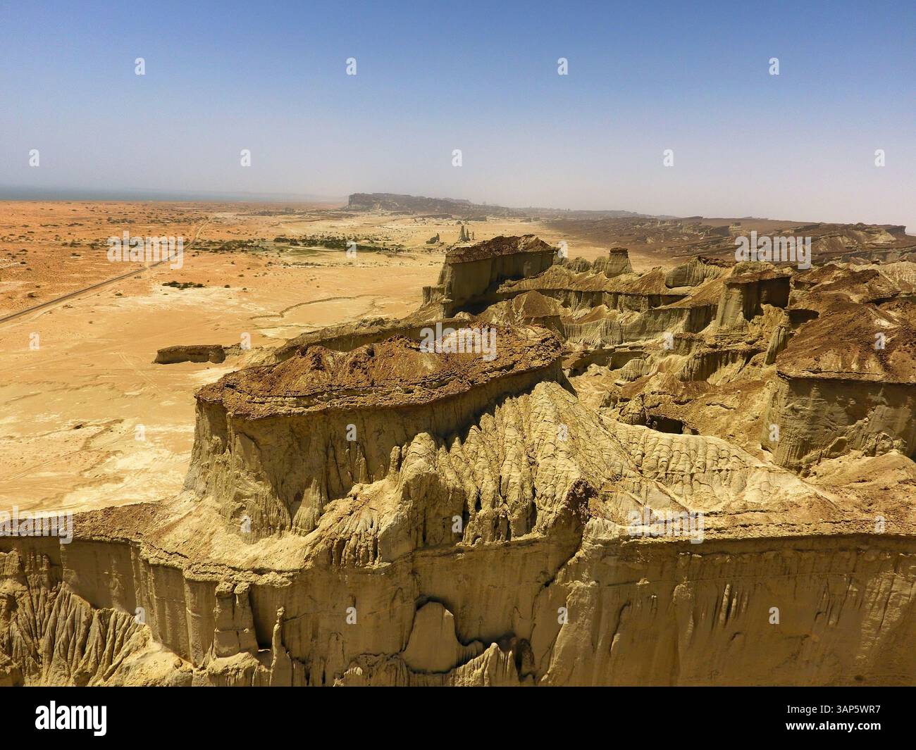 Aerial view of arid desert, rocky mountains, and cliffs in Gwadar ...