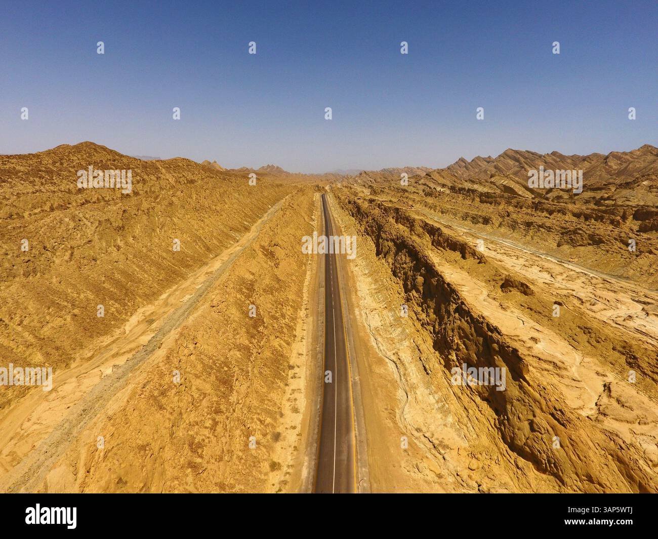 Aerial view of rocky desert road and mountains, ormara, balochistan ...