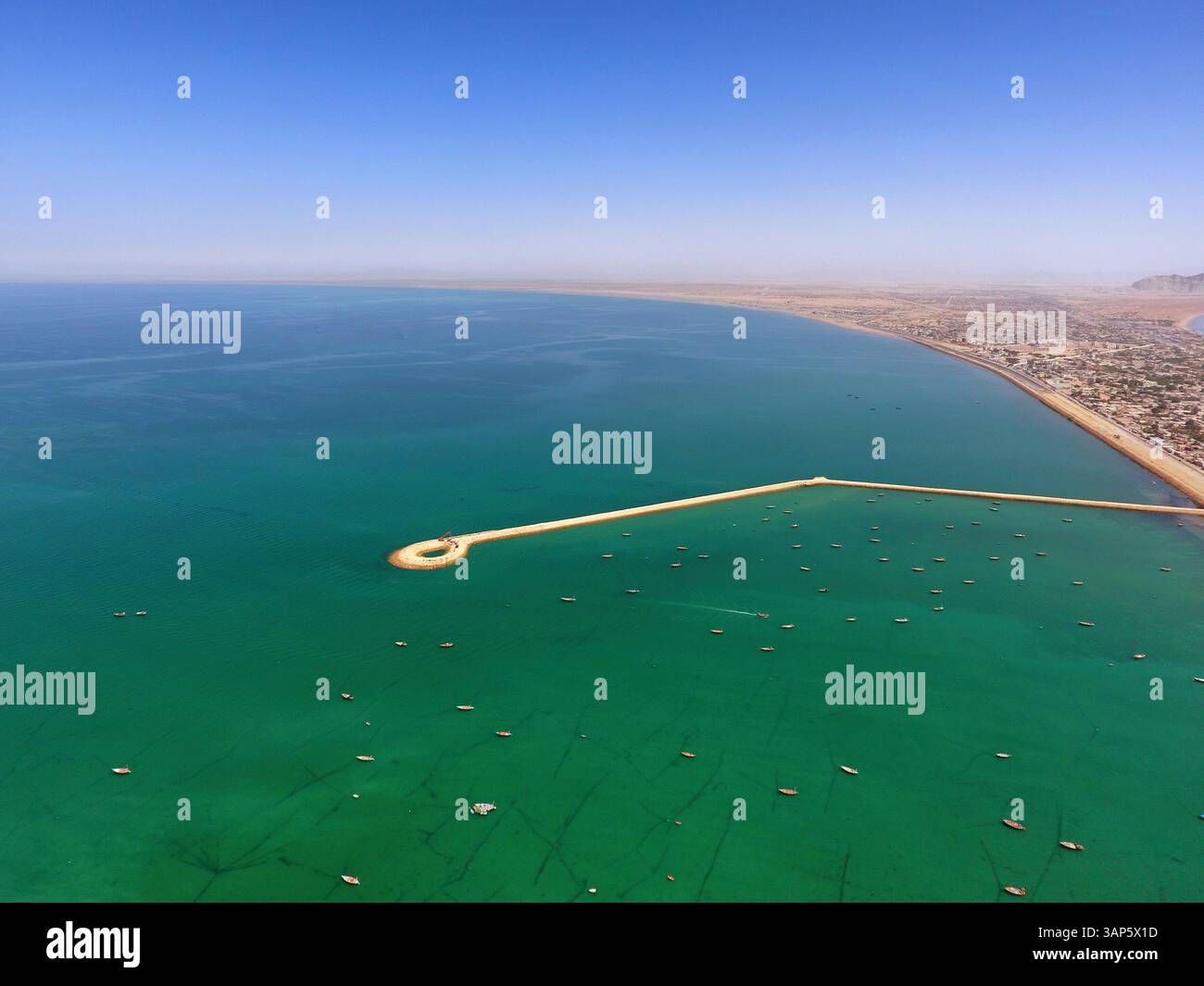 Aerial view of sandy beach and turquoise sea at Paddi Zirr Gulf, Gwadar ...
