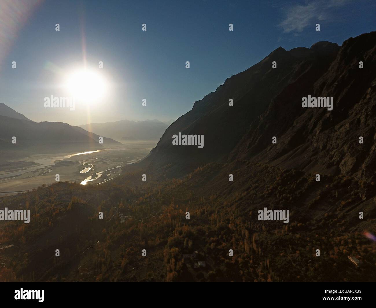 Aerial view of majestic mountains and serene valley at Shangri-La ...