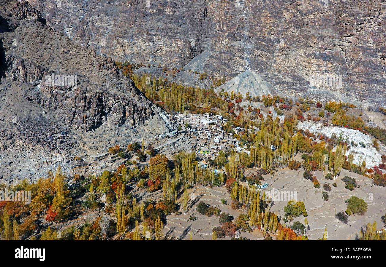 Aerial view of colorful village nestled among majestic mountains with ...