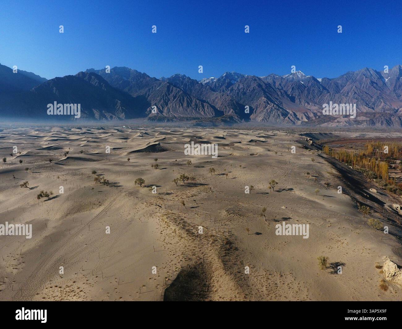Aerial view of vast desert and majestic mountains in Katpana Desert ...