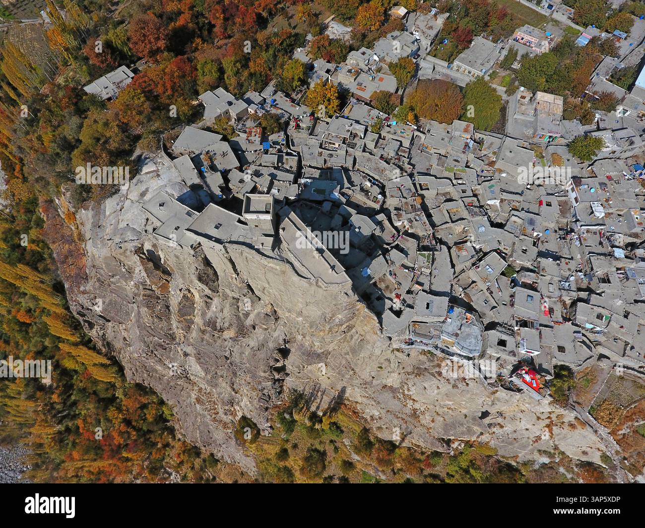 Aerial view of village nestled in forested cliff overlooking Hopar ...