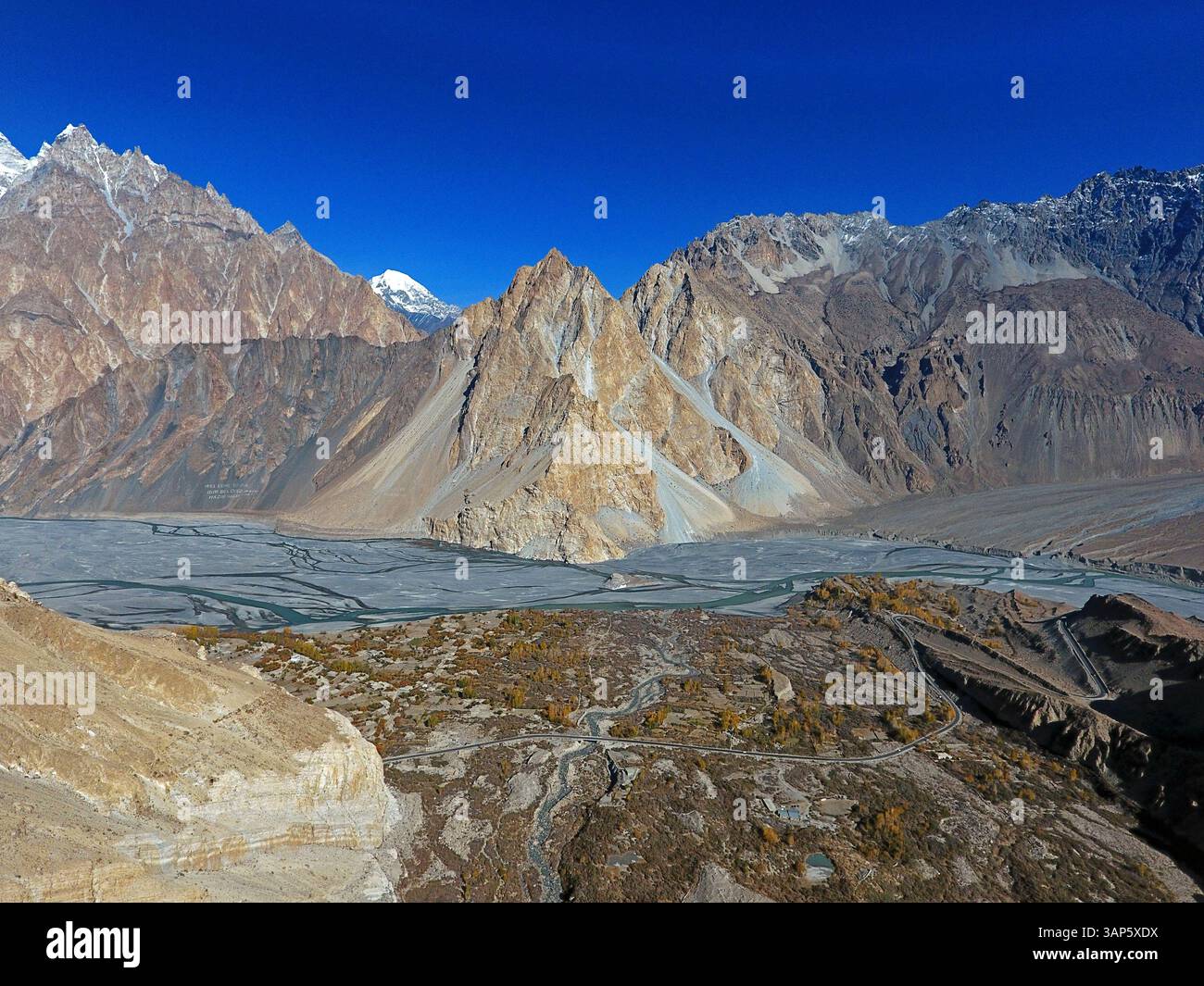 Aerial view of majestic Passu Cones and serene Hunza River in remote ...
