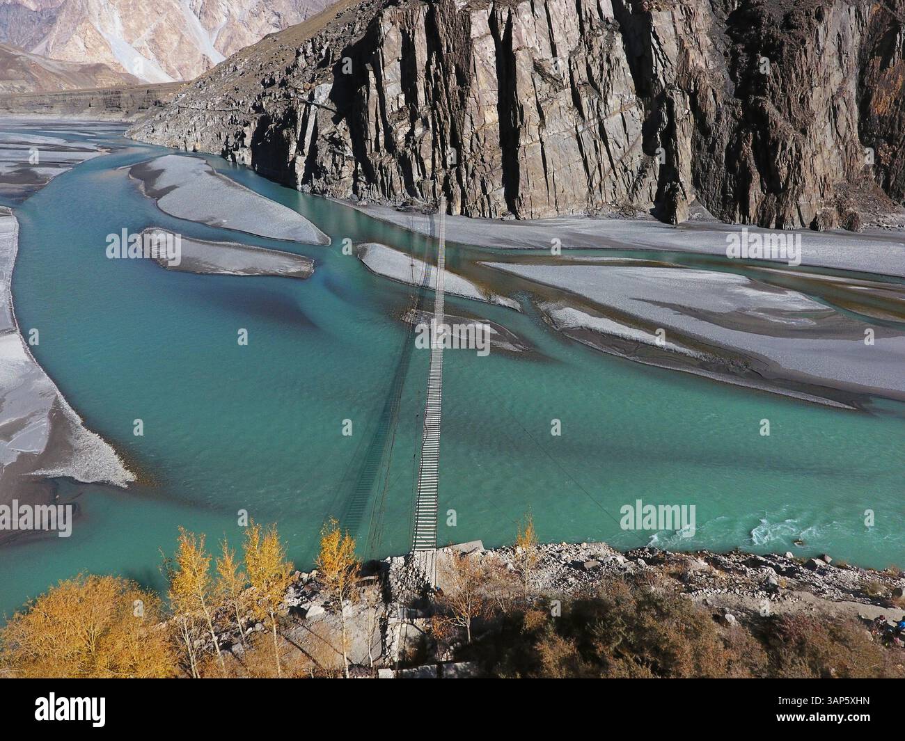 Aerial view of Hunza River with Passu Cones and autumn trees, Hunza ...