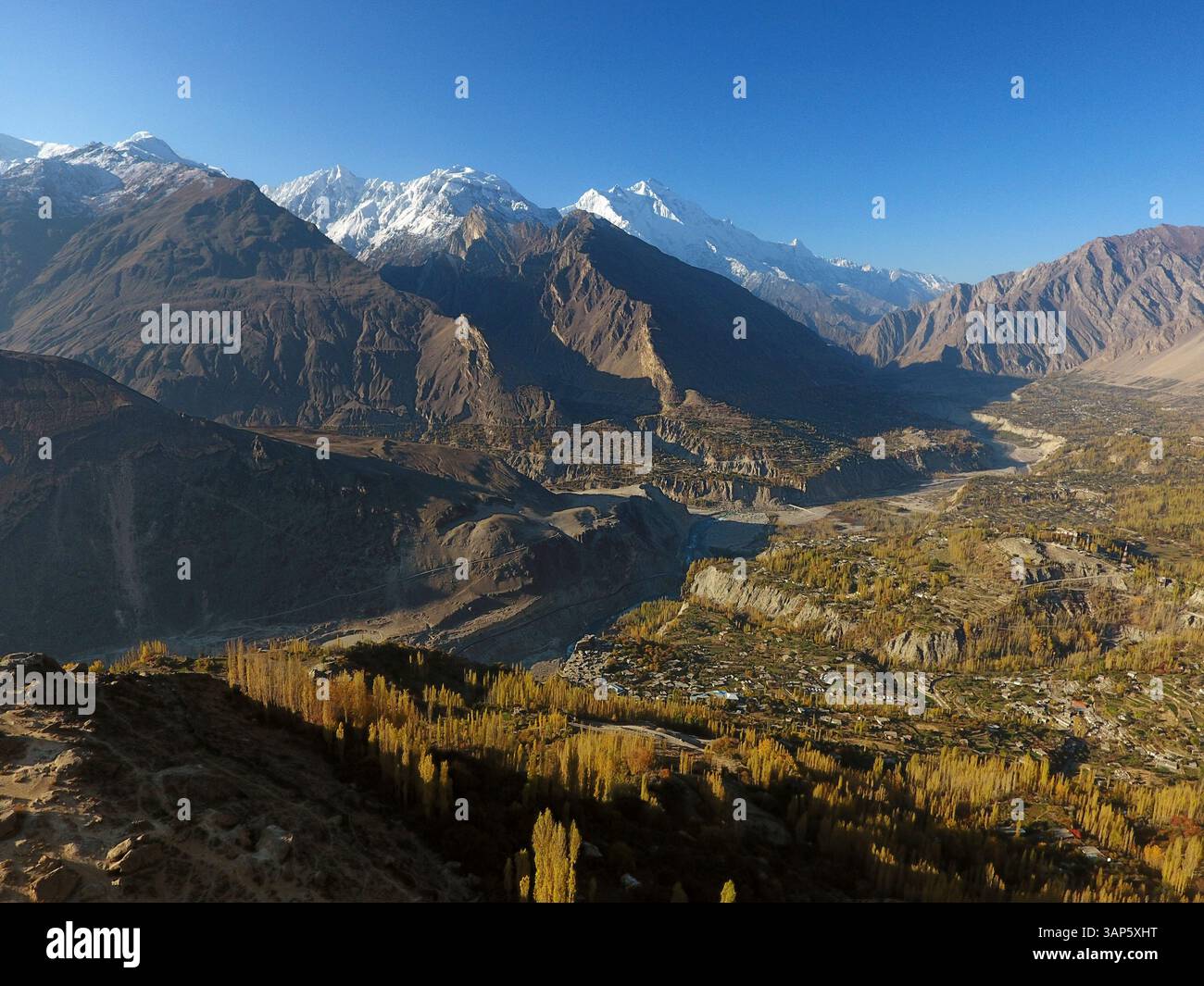 Aerial view of majestic Hunza Valley with snow-capped mountains and ...