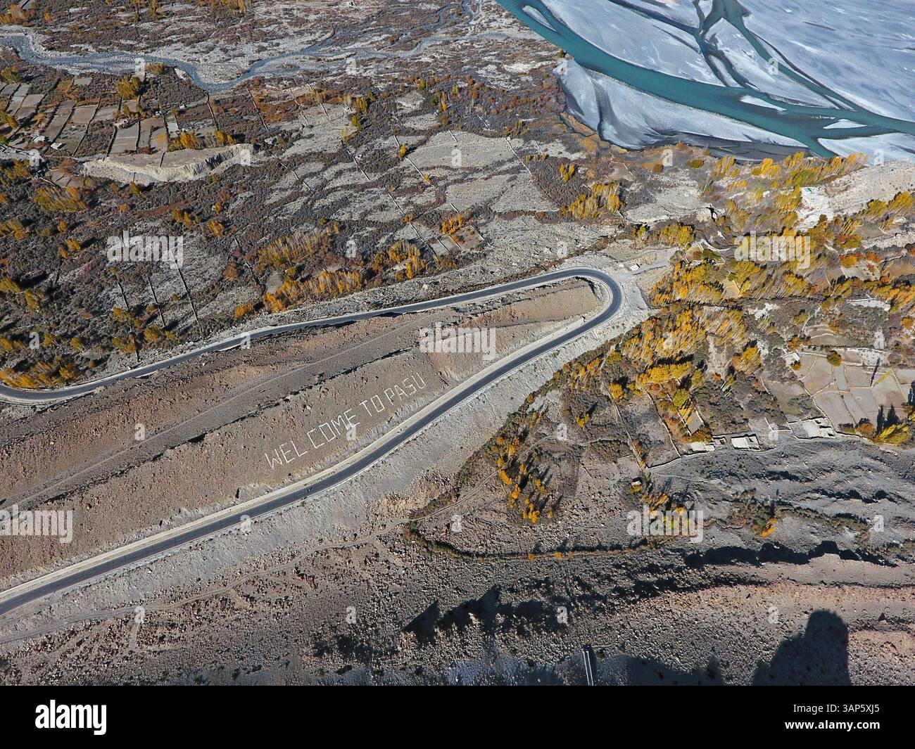 Aerial view of winding road through autumnal Hunza Valley with Hunza ...