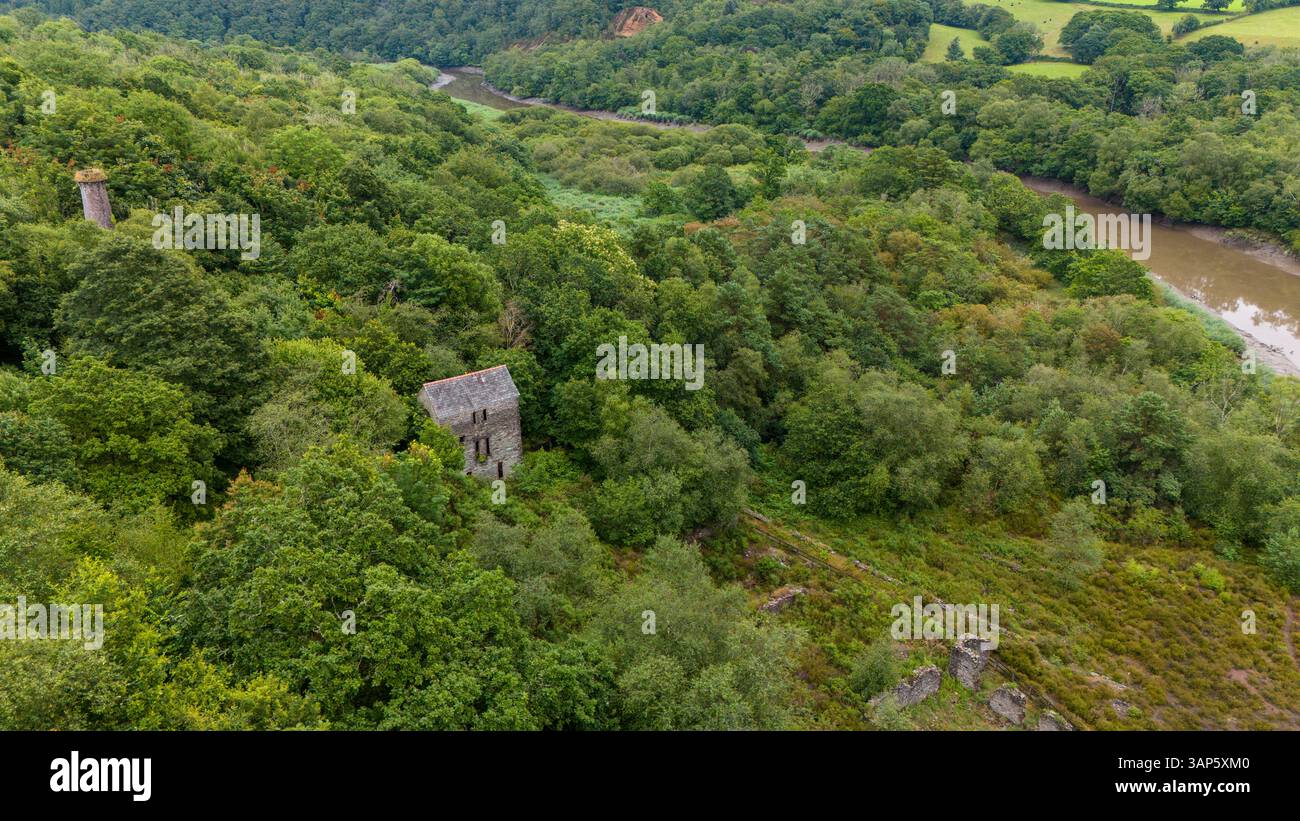 Aerial view of lush green countryside with historic mining ruins and a ...