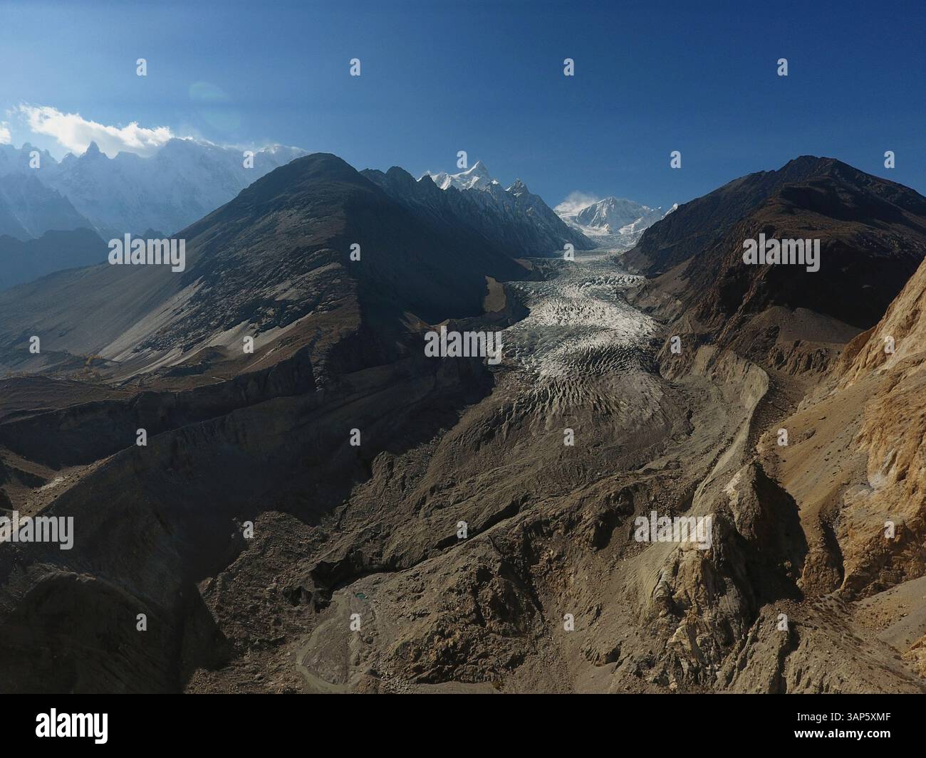 Aerial view of snow-covered mountains and glaciers in Hunza Valley ...