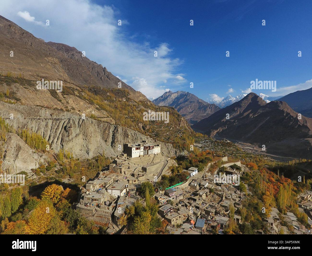 Aerial view of picturesque village surrounded by majestic mountains and ...