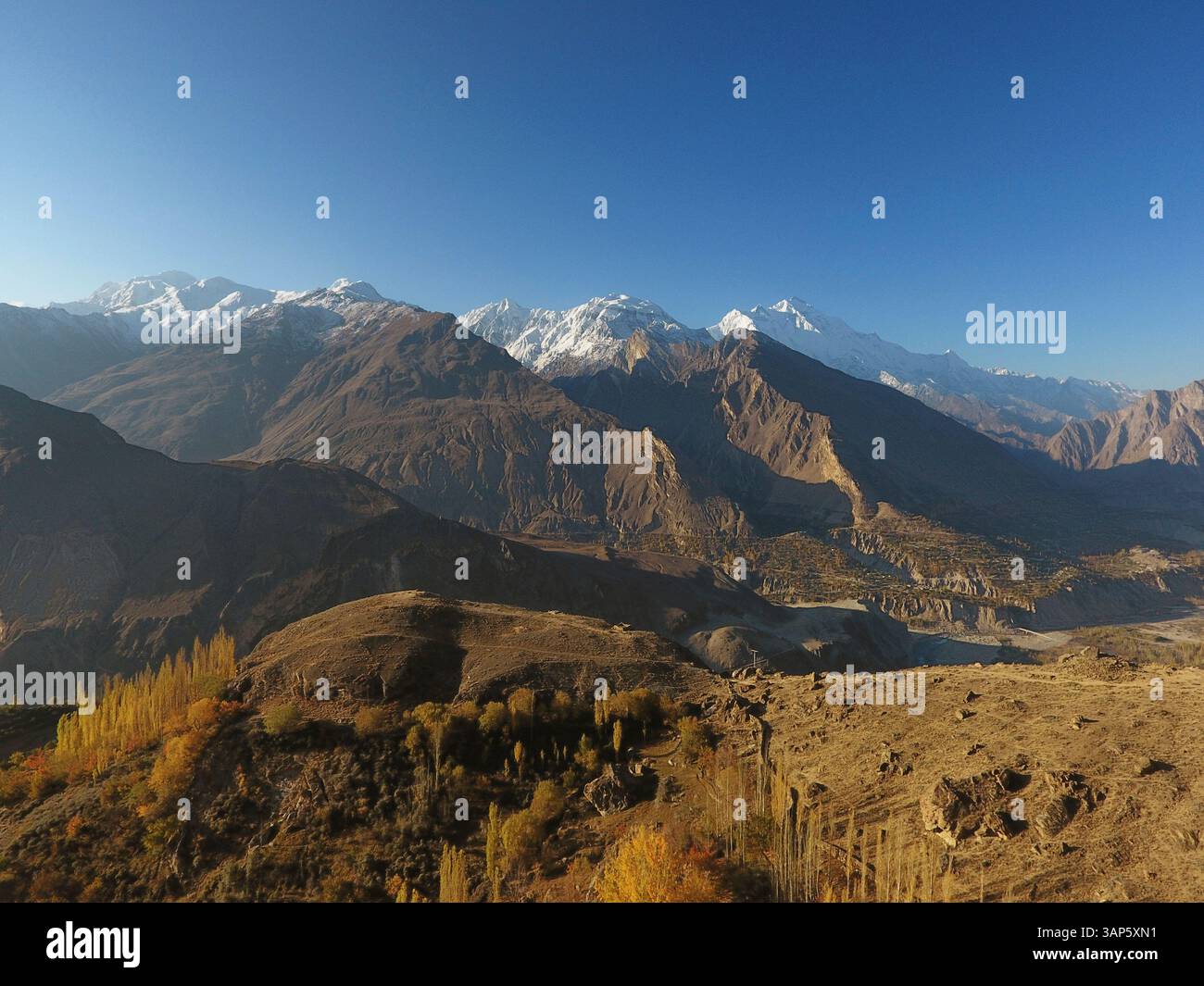 Aerial view of majestic peaks and snow capped mountains in winter ...
