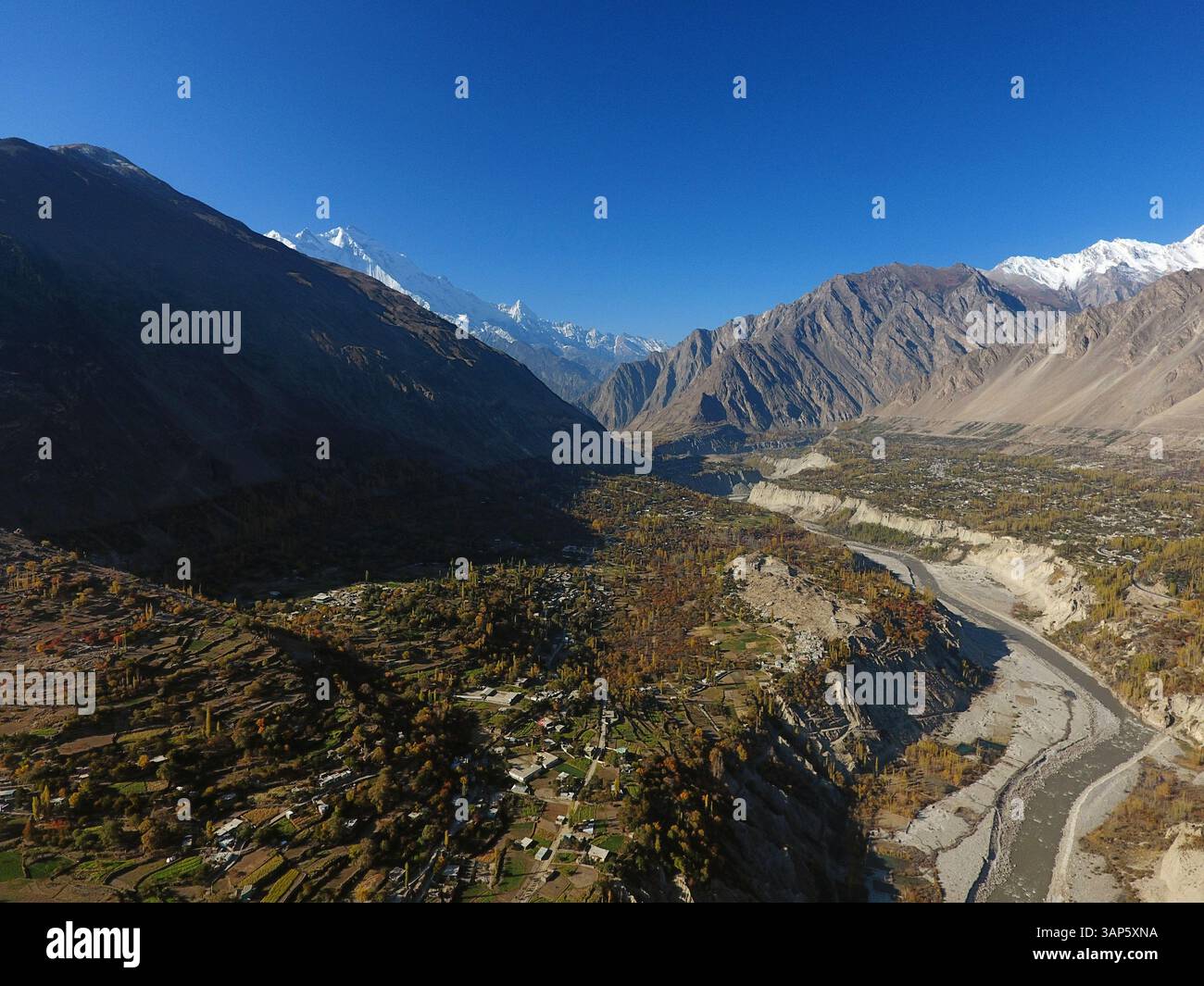 Aerial view of Majestic Hunza Valley with Snow Capped Mountains and ...