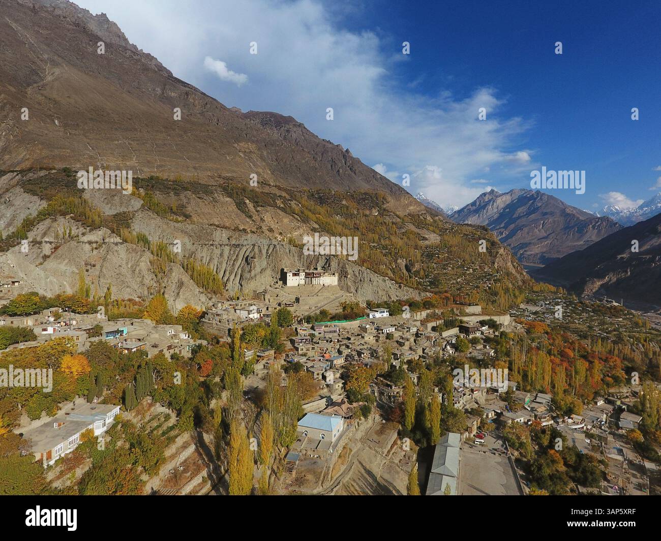 Aerial view of Majestic Himalayan mountains and traditional village in ...