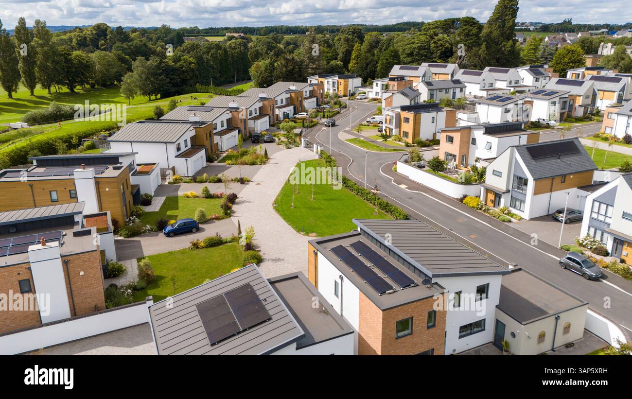Aerial view of modern luxury residential development with solar panels ...