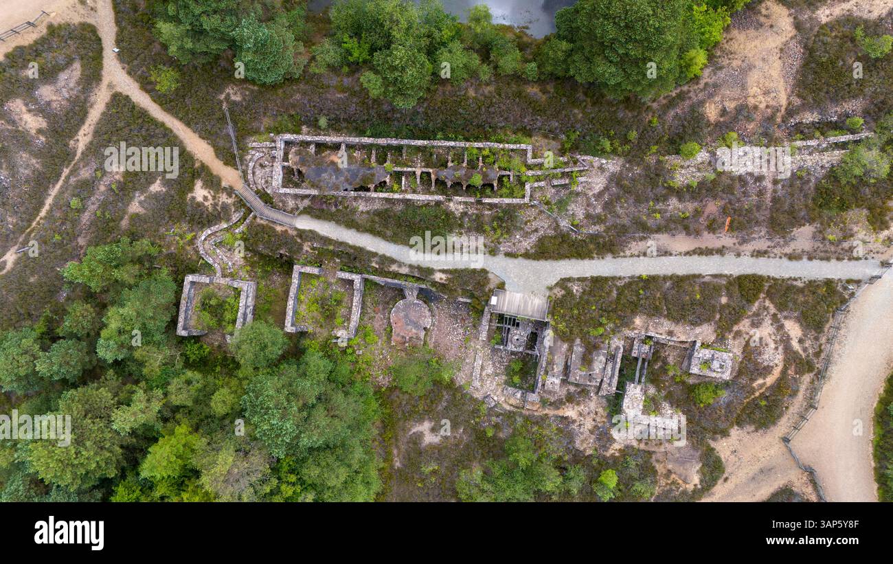 Aerial view of ancient cornish mining ruins surrounded by lush greenery ...