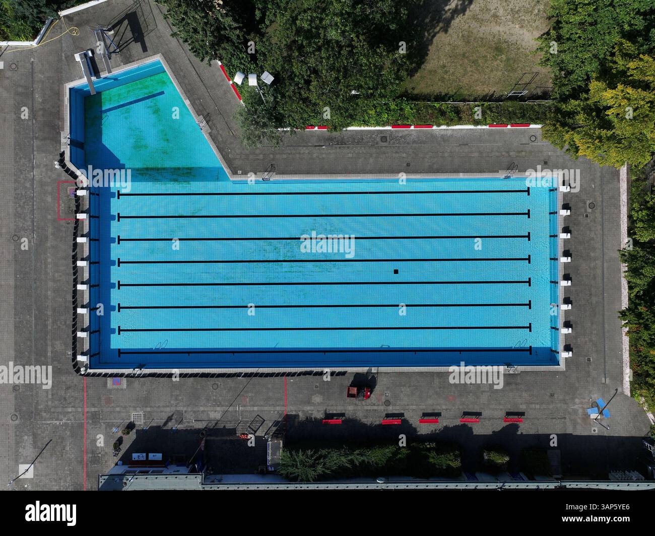 Aerial view of a tranquil public swimming pool with organized lanes ...