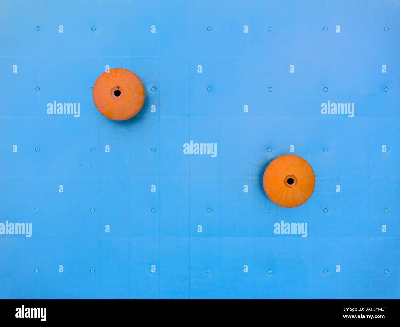 Aerial view of vibrant public pools with circular structures and ...