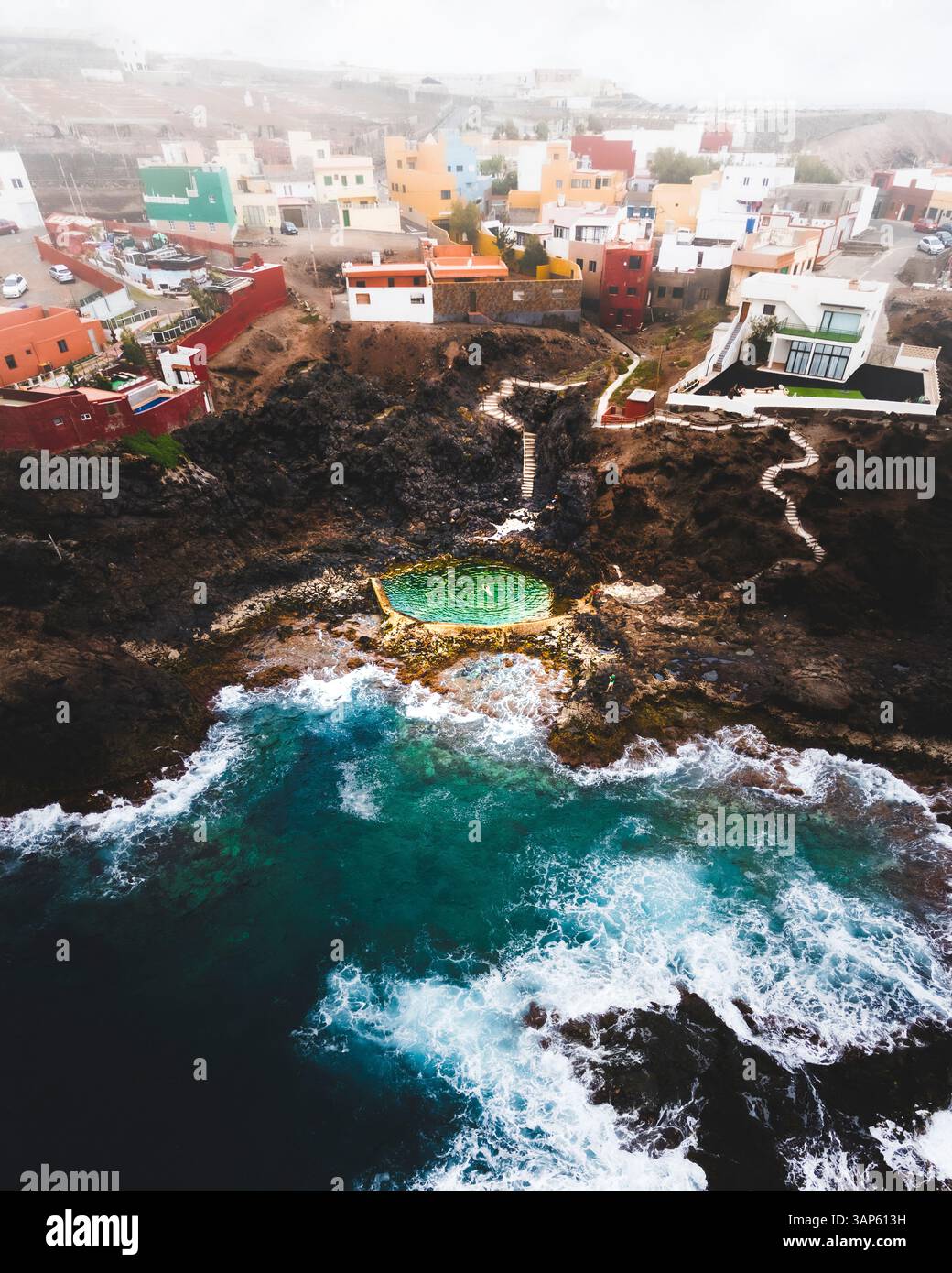 Aerial view of the little village of Punta de Galdar, a townscape built ...