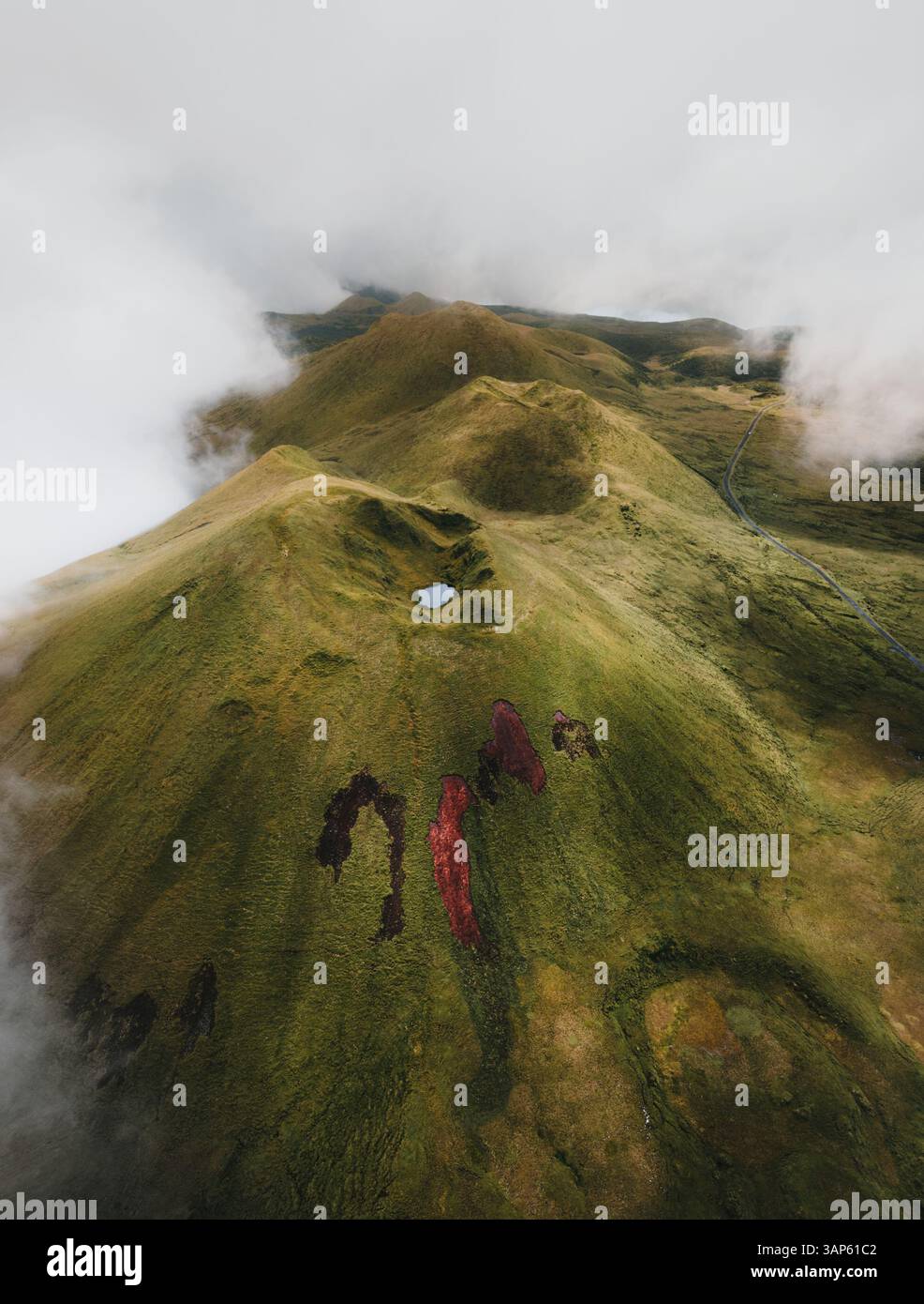 Aerial view of a Volcano peak with crater on Pico Island during a misty ...