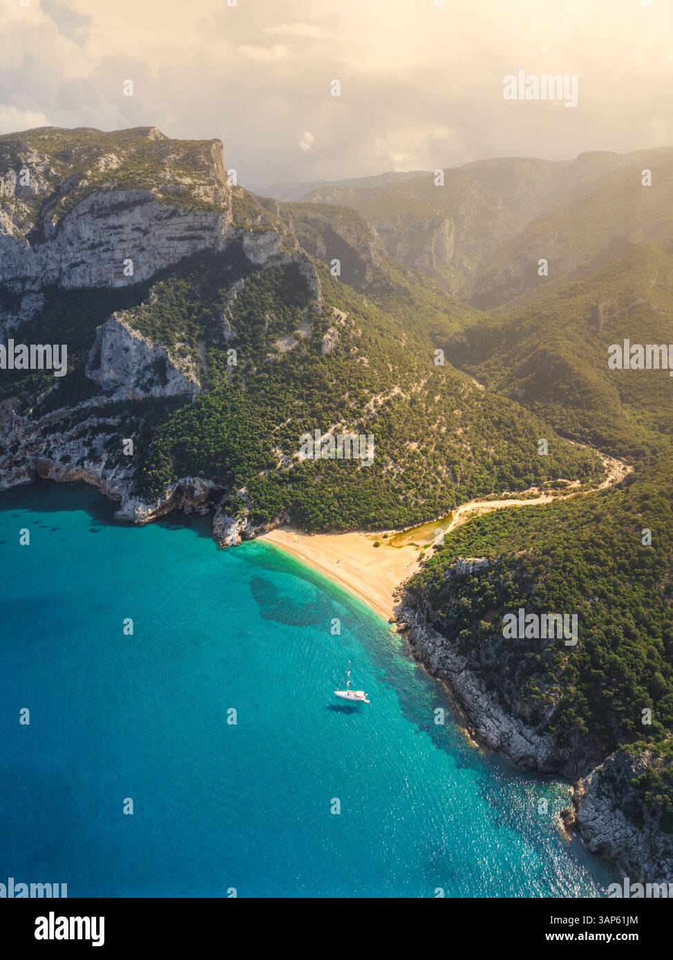 Aerial view of a small boat floating near a paradise beach, view of the ...