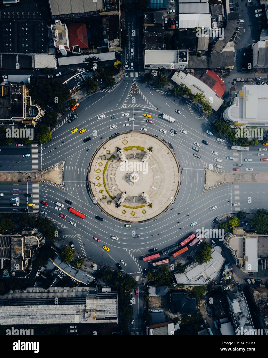 Aerial view of the vehicles driving next to the Democracy Monument at ...