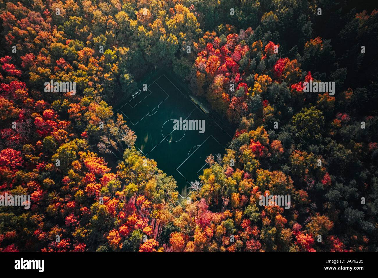 Aerial view of football field in autumn colours at sunrise, Moscow ...