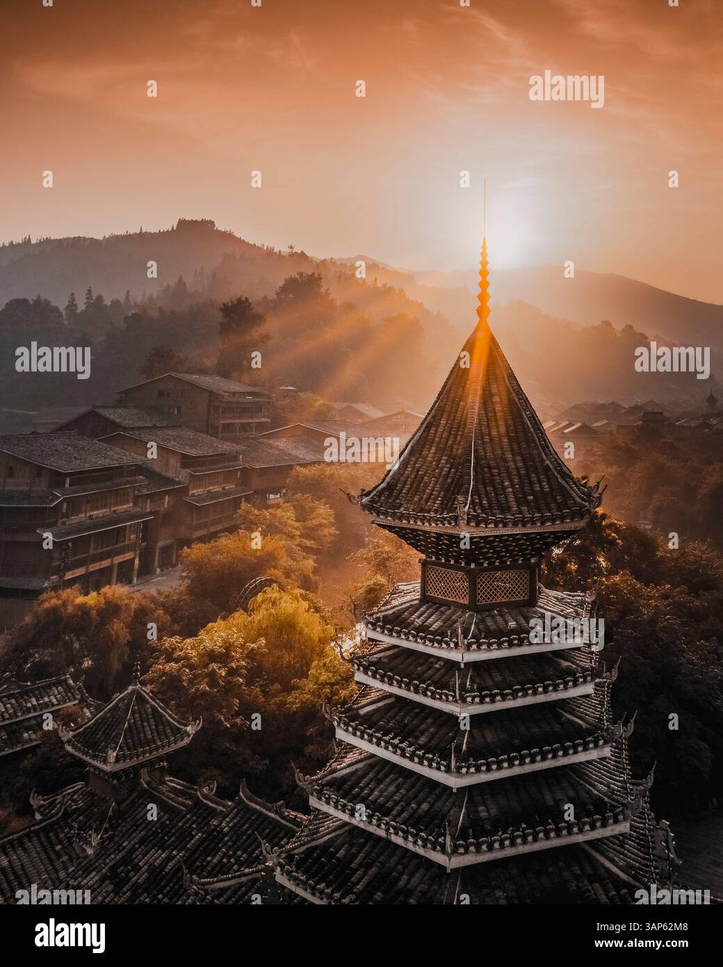 Aerial view of tower in Dong village at sunrise in Guizhou, China Stock Photo - Alamy