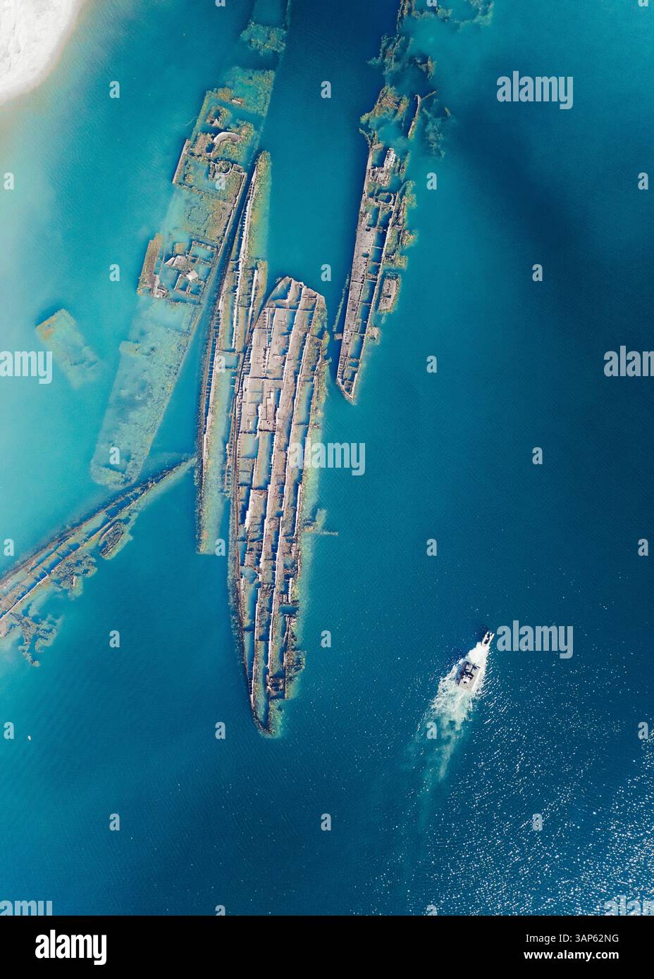 Aerial view of boat passing by shipwreck site on Russky Island near ...