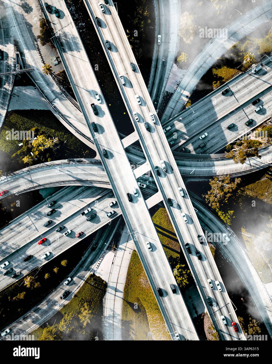 Aerial view of a busy highway intersection with vehicles driving on the ...