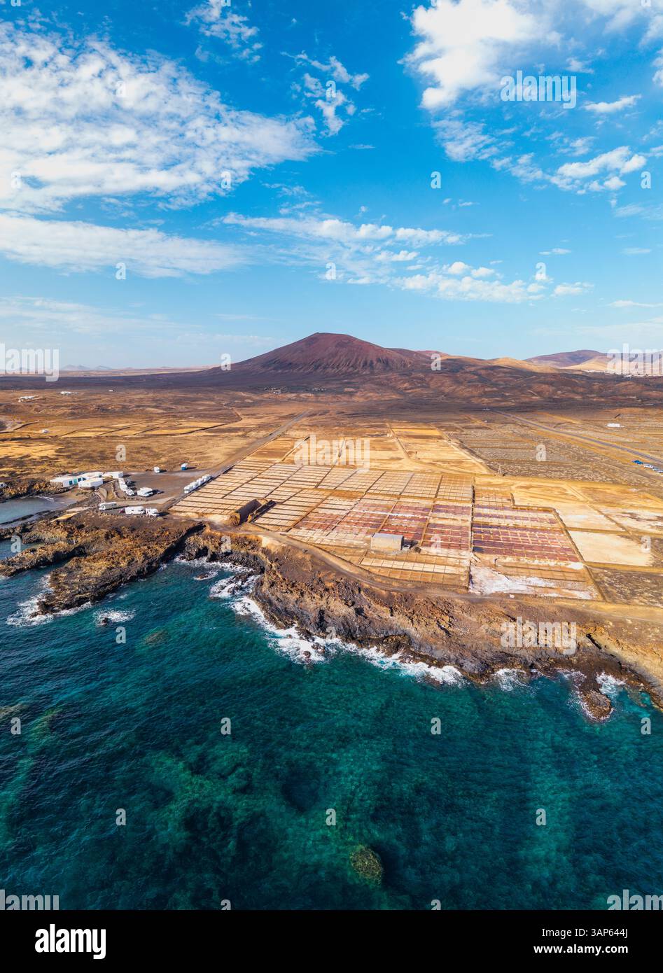 Aerial view of tinamala mountain and salt flats with traditional houses ...