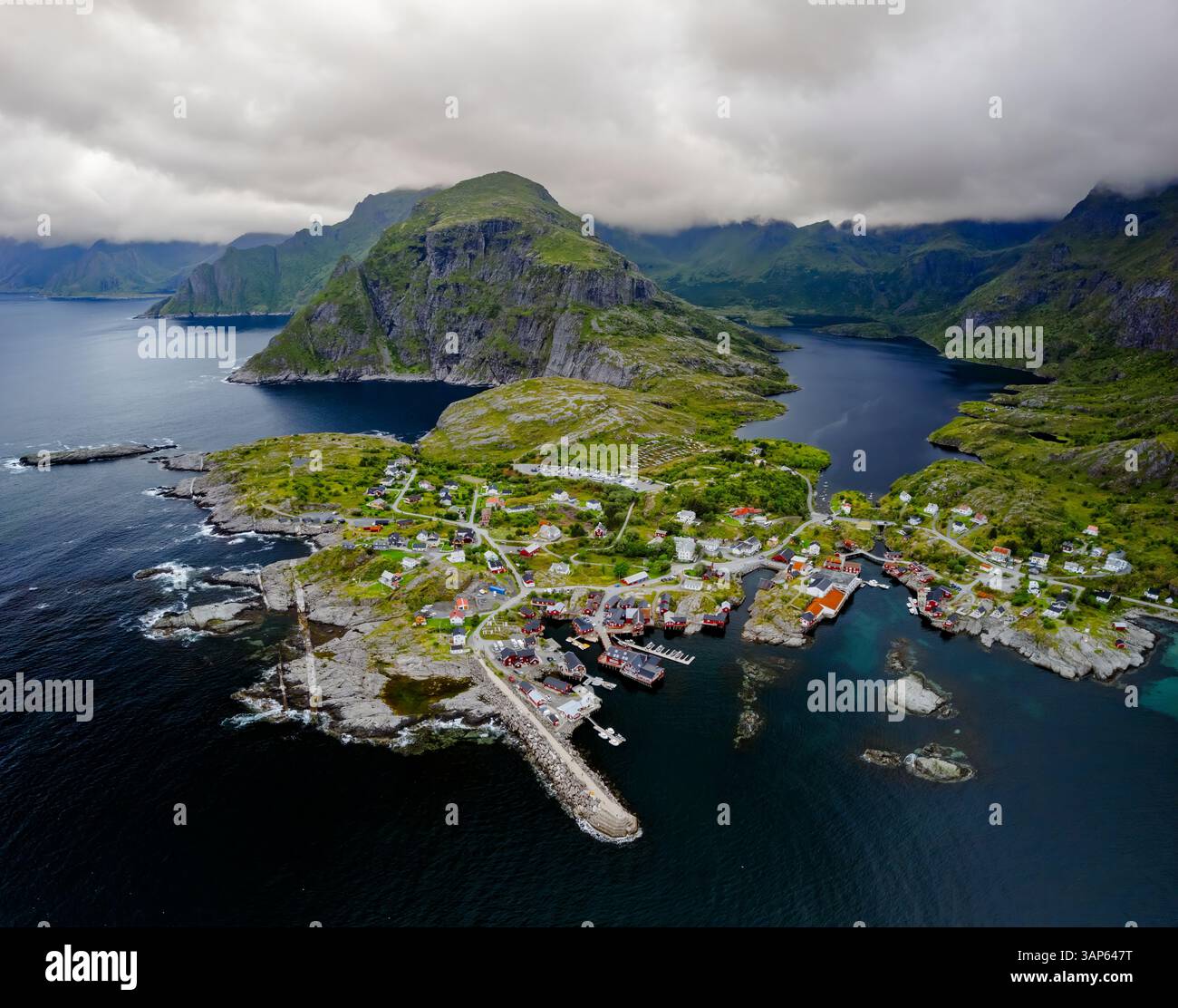 Aerial view of a picturesque traditional village with boats and a pier ...