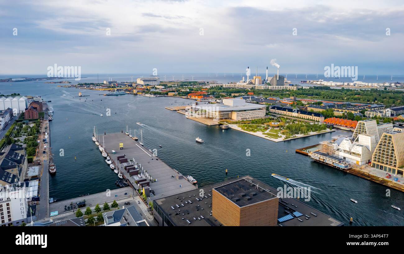 Aerial view of operapark and copenhill by the canal with boats in the ...