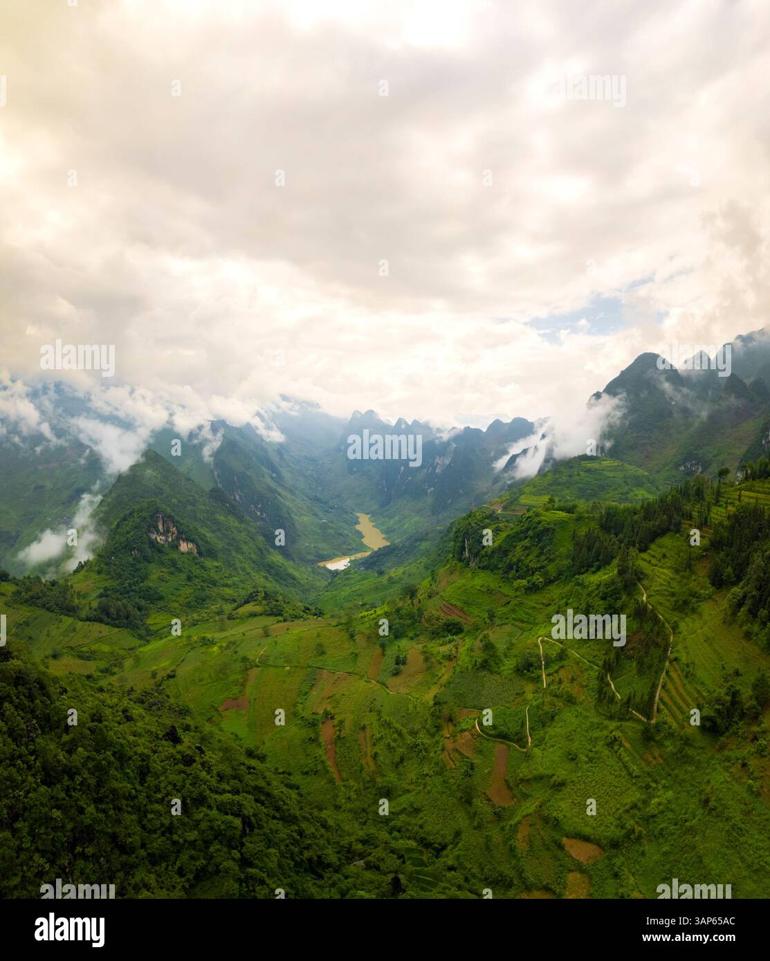 Aerial view of lush valley and river in Tu San Canyon, Nho Que River ...