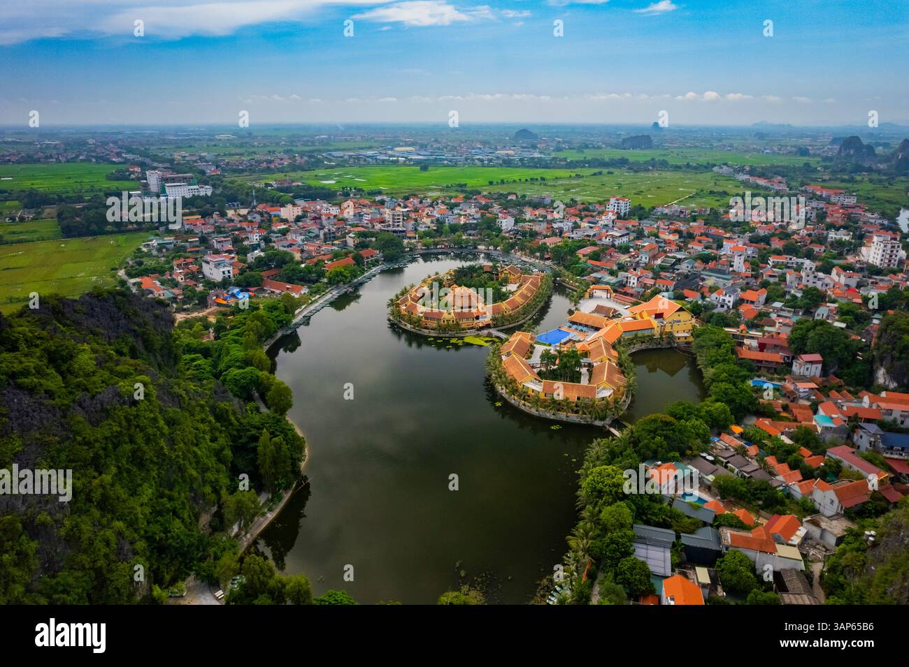 Aerial view of city, river, buildings, greenery, and lake, downtown Tam ...