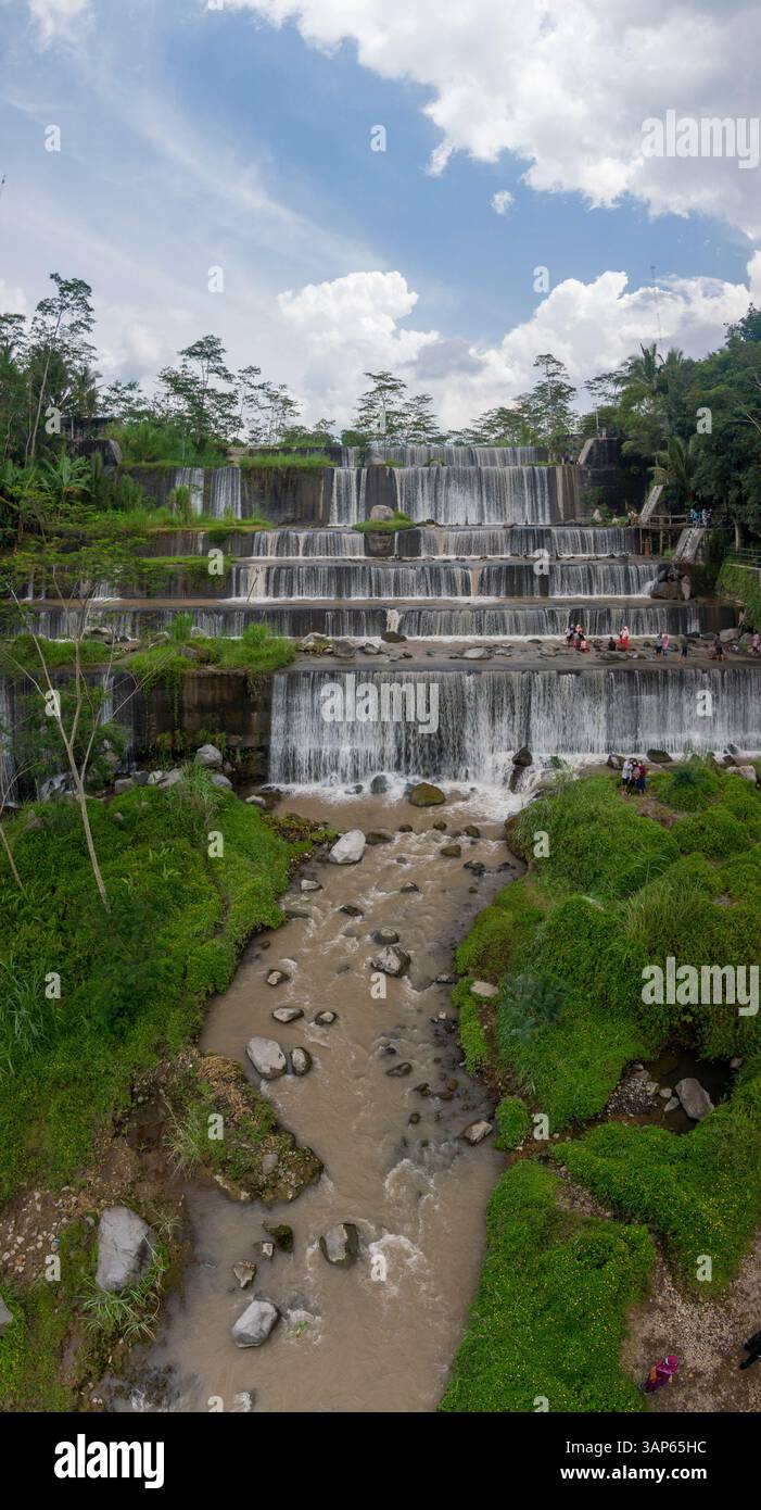 Aerial view of seven tiered waterfall surrounded by lush greenery and ...