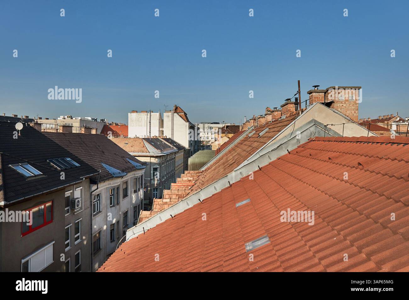 Tiled Building Roofs Over a City Street Stock Photo - Alamy